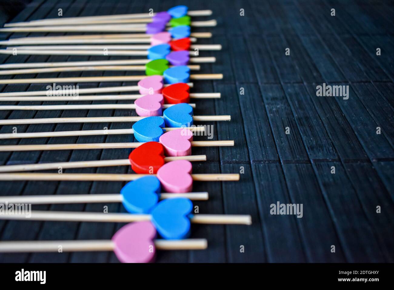 Decorative wooden sticks in a row Stock Photo - Alamy