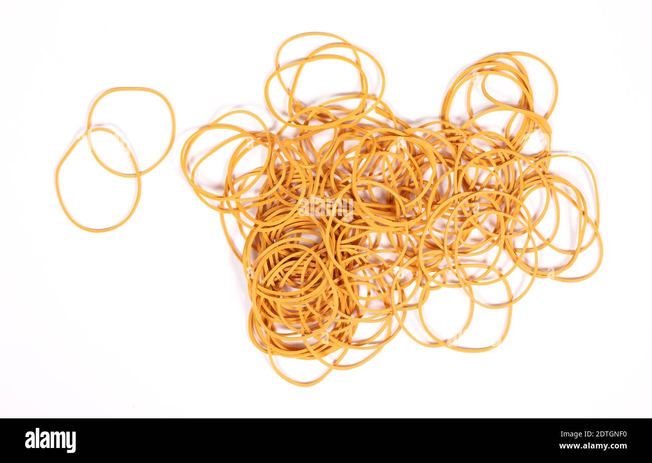 Yellow rubber elastics isolated on a white background Stock Photo - Alamy