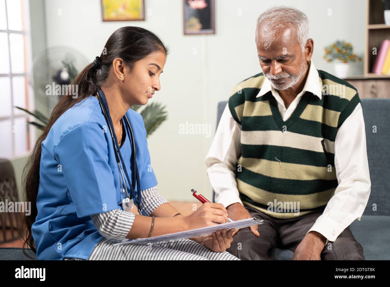 Indian doctor hospital patient writing hi-res stock photography and ...