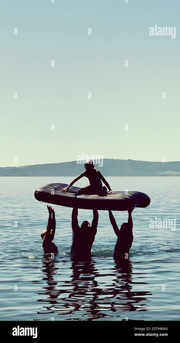 Young men and women in raft hi-res stock photography and images - Alamy