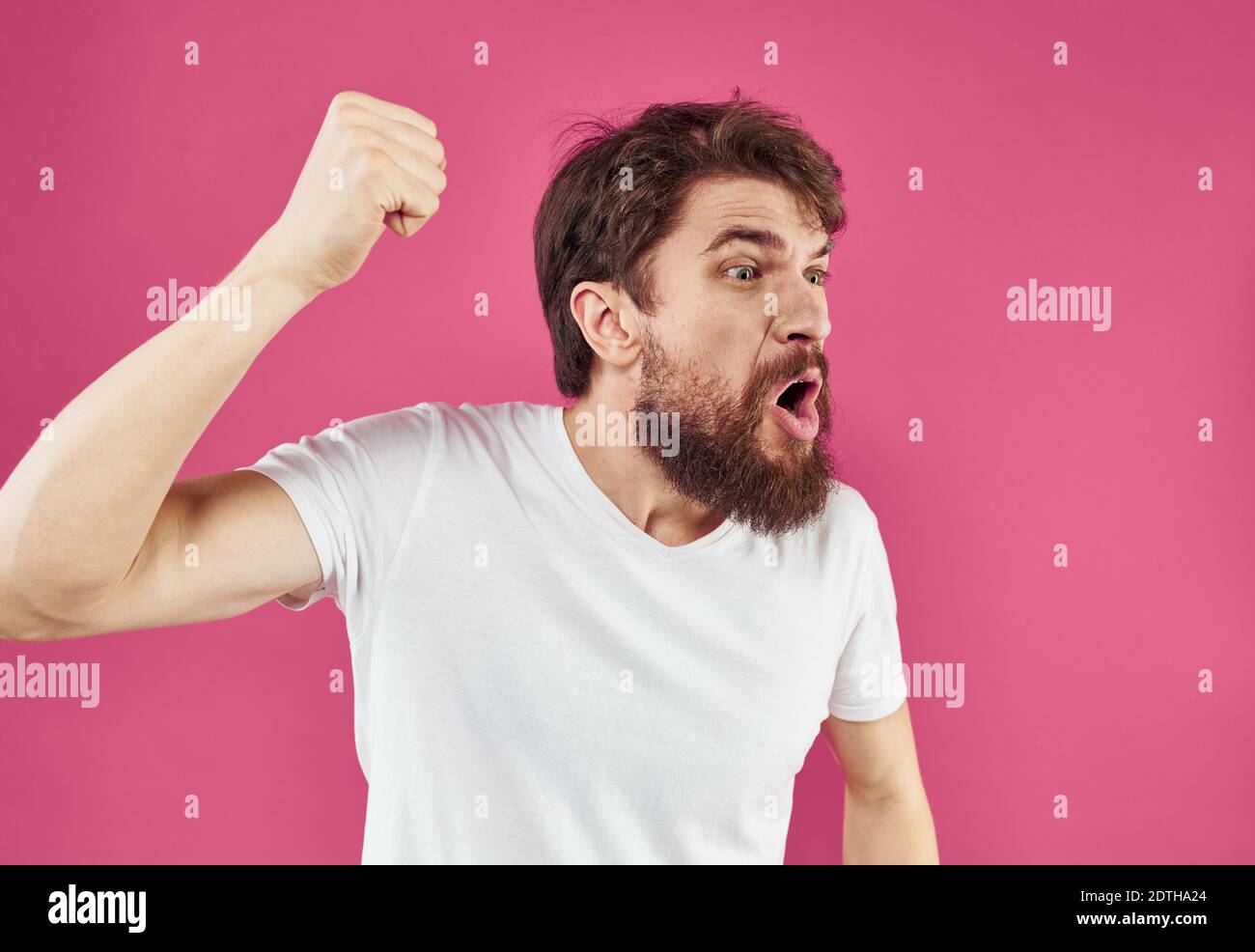 Man on pink background stress irritability aggression gesticulating ...