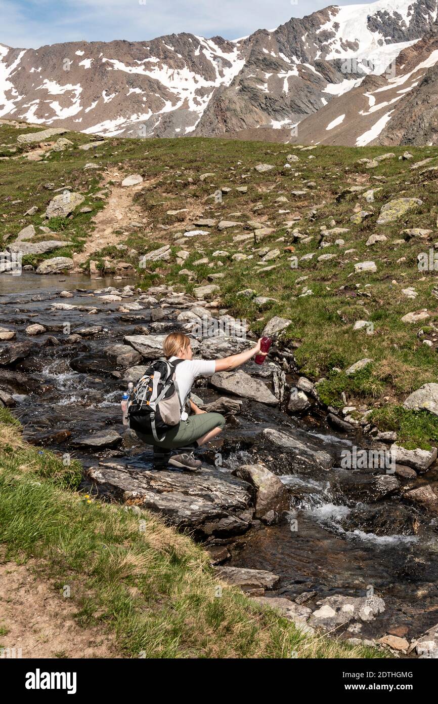 Rear view crouching on rock hi-res stock photography and images - Alamy