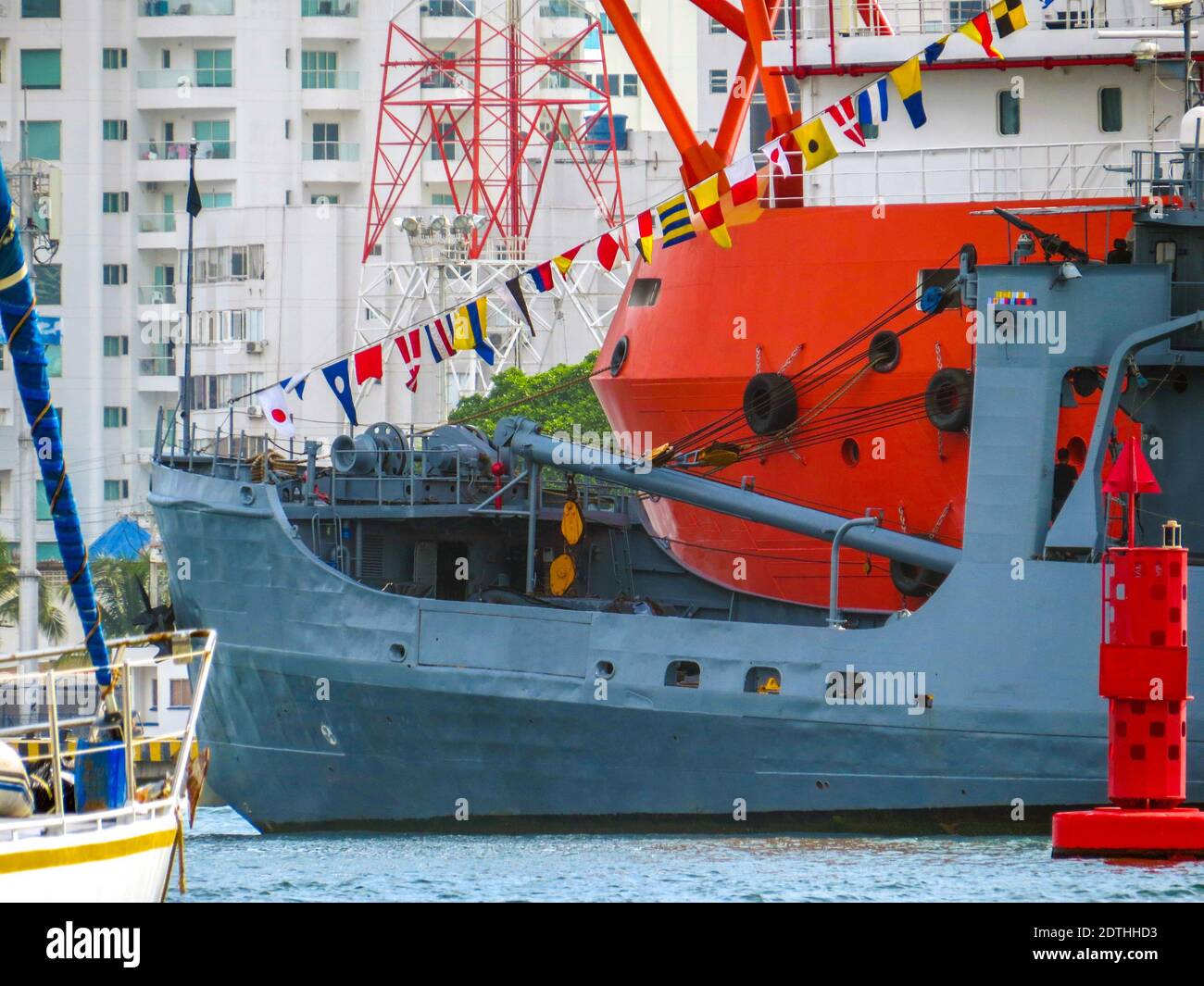 Military Ship Sailing On Sea By City Stock Photo - Alamy