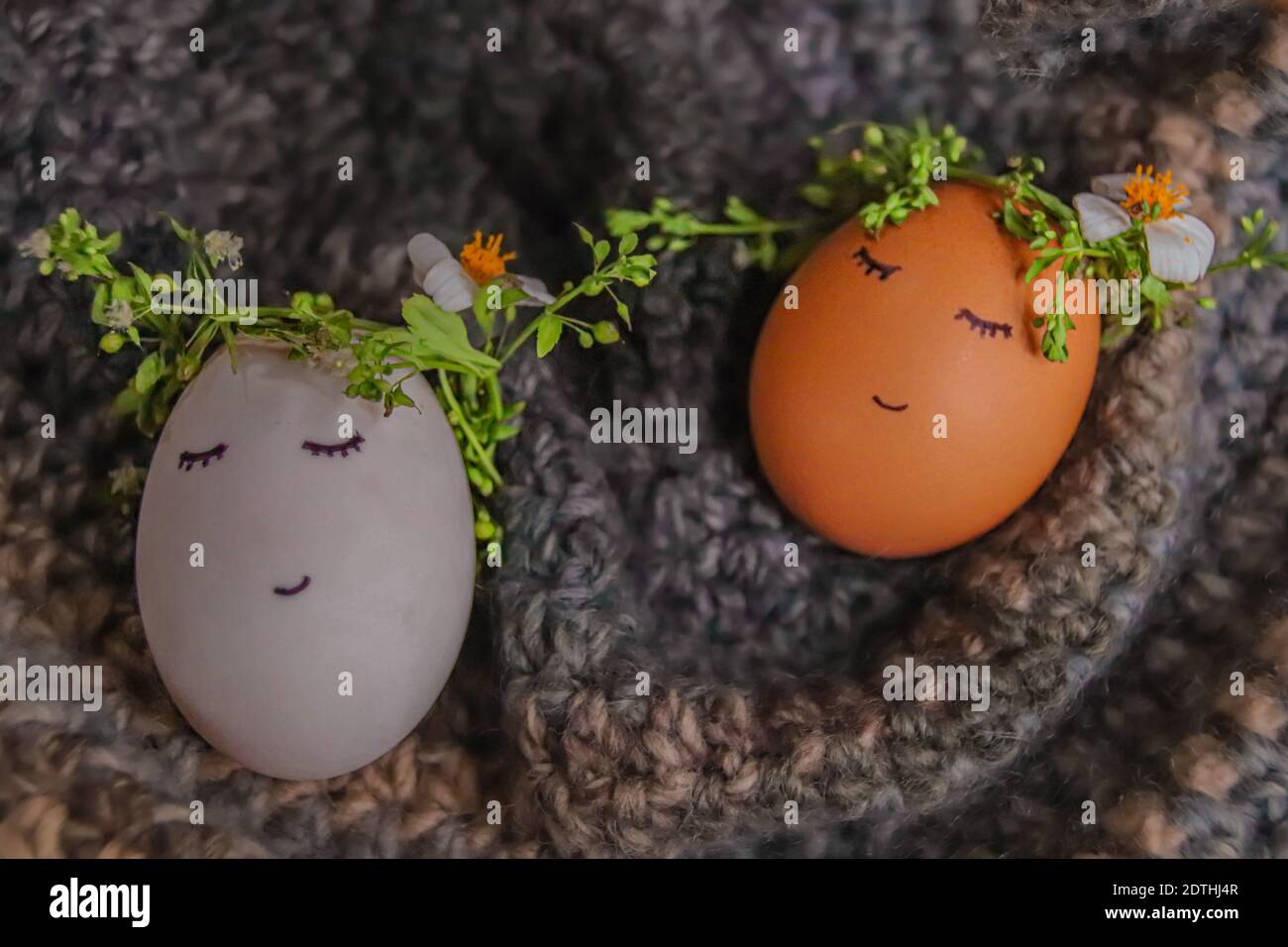 Cute eggs wearing flower crowns with drawn faces as decoration for ...