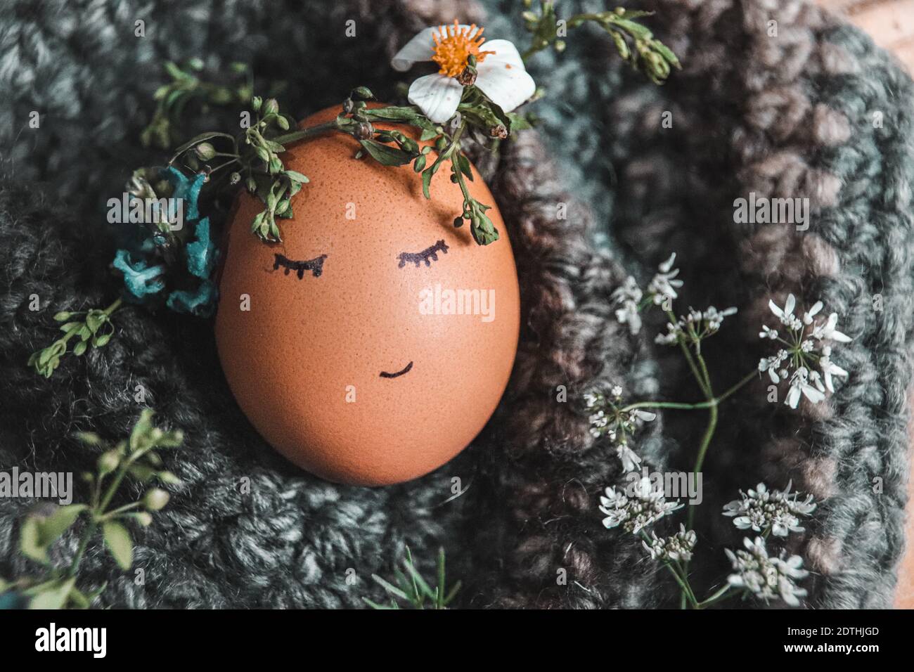 Cute eggs wearing flower crowns with drawn faces as decoration for ...