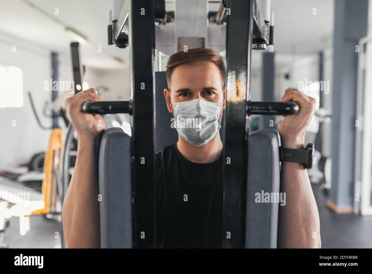 Strong man exercising gym muscular sport hi-res stock photography and ...