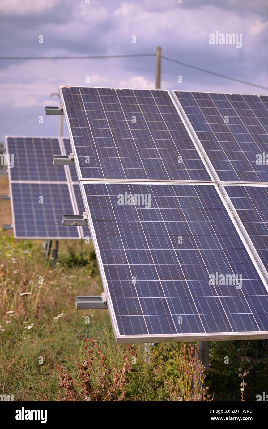 A vertical shot of solar panels - renewable energy, ecology concept ...