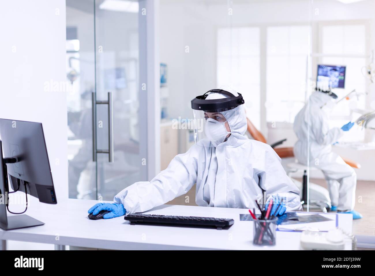 Medicine practitioner dressed in pee suit during covid 19 as safety ...