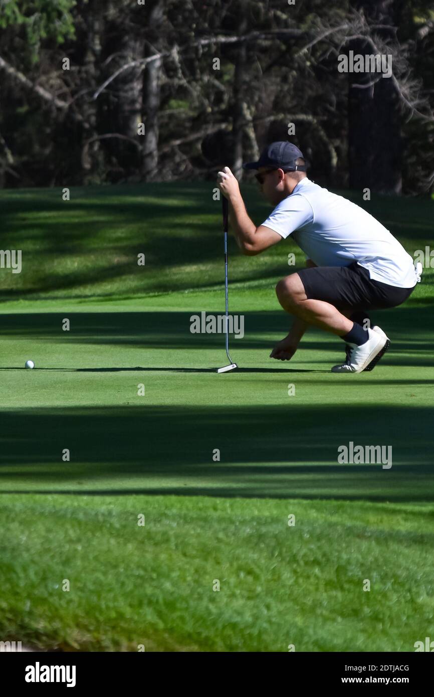 Man crouching playing golf hi-res stock photography and images - Alamy