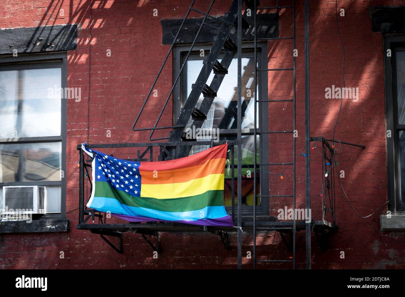 Flag on fire escape hi-res stock photography and images - Alamy