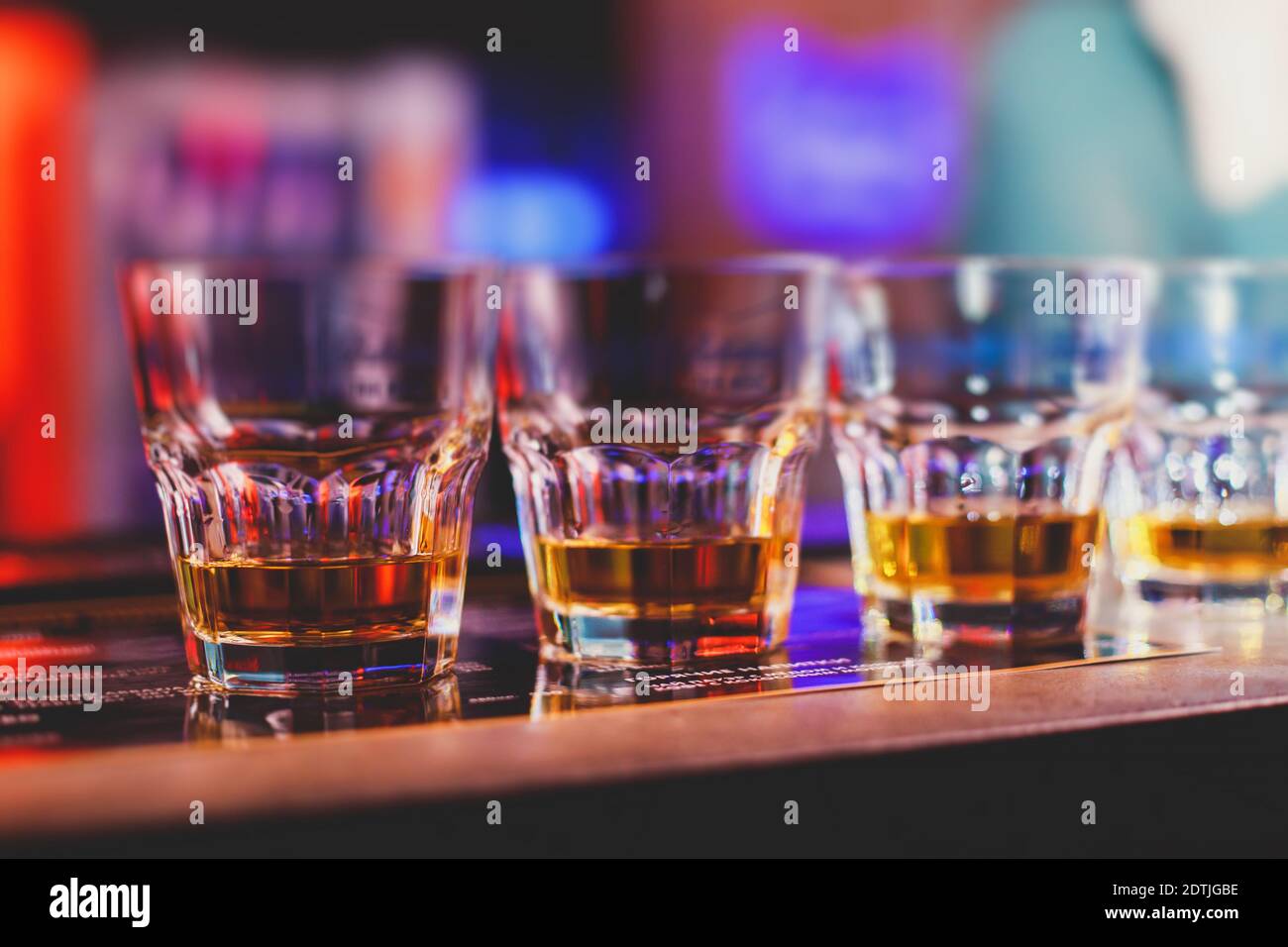 Beautiful row of different colored alcohol cocktails on a party ...