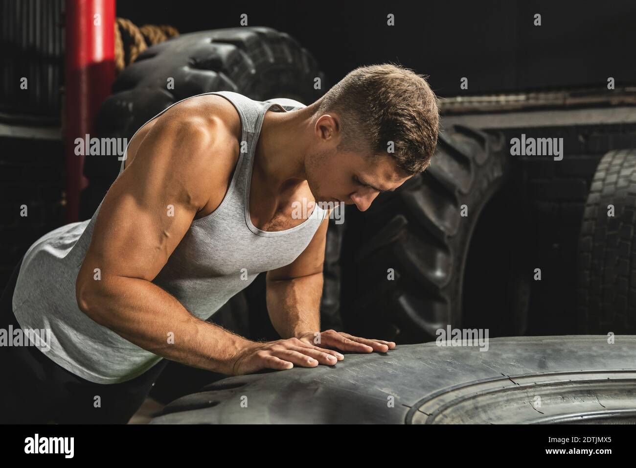 Sport man push tire on hi-res stock photography and images - Alamy