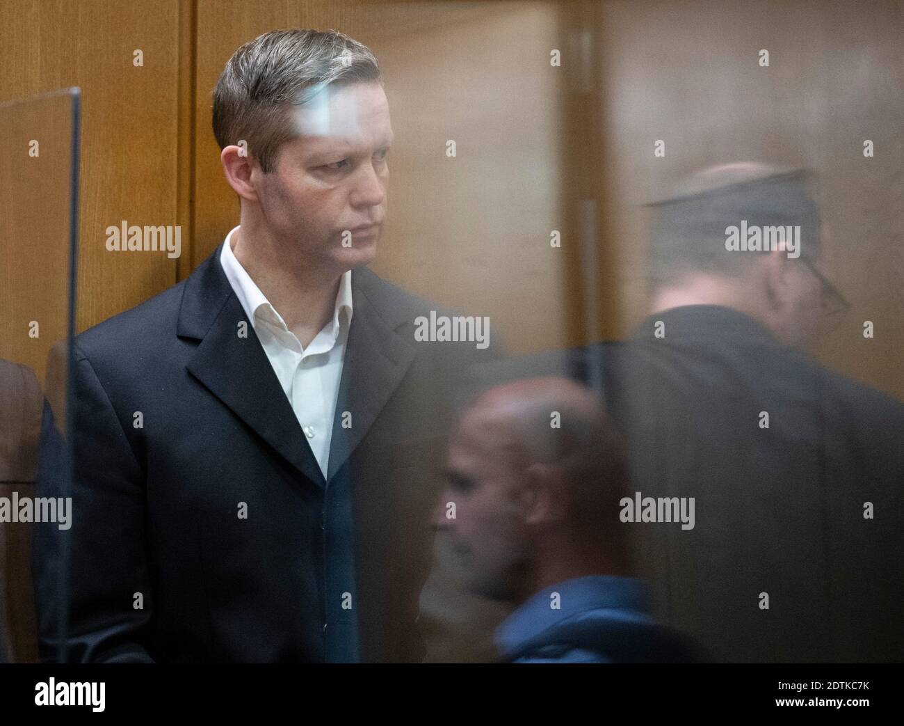 22 December 2020, Hessen, Frankfurt/Main: The main defendant Stephan Ernst stands at his place ...