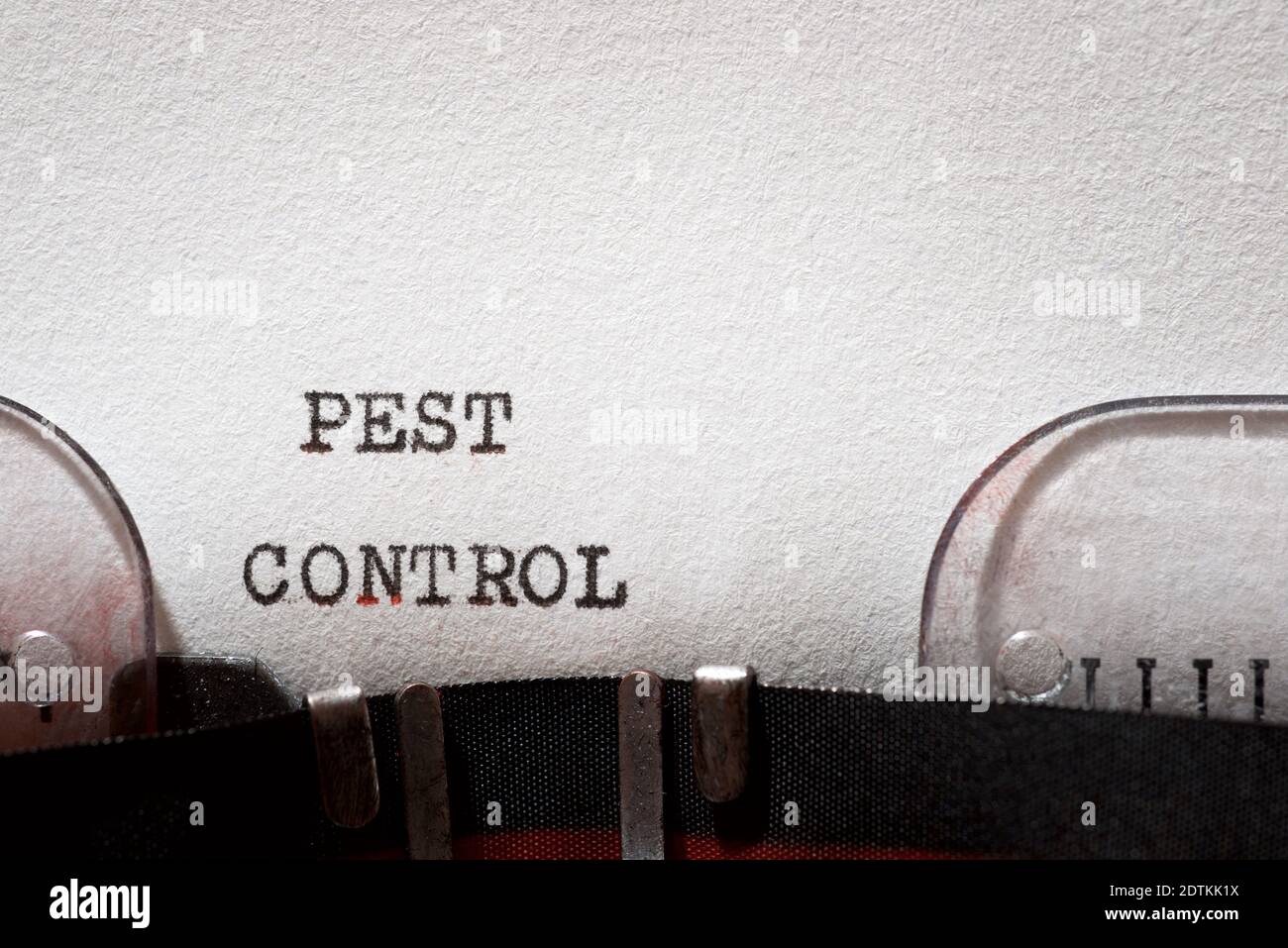 Pest control phrase written with a typewriter Stock Photo - Alamy