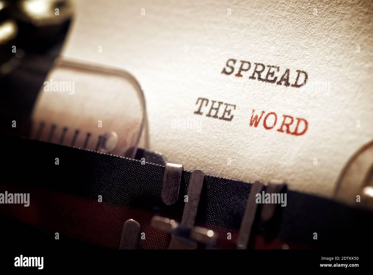 Spread the word phrase written with a typewriter Stock Photo - Alamy