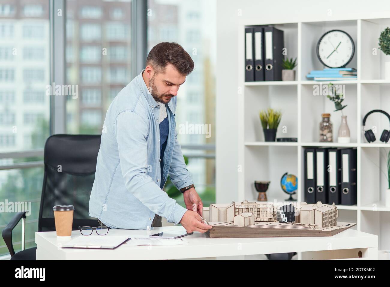 Handsome senior architect working on a construction project, he ...