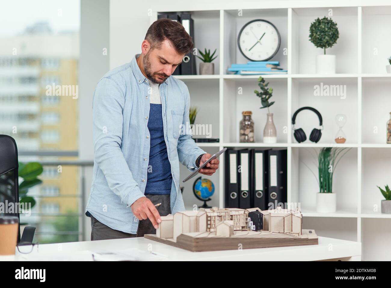 Handsome senior architect working on a construction project and ...