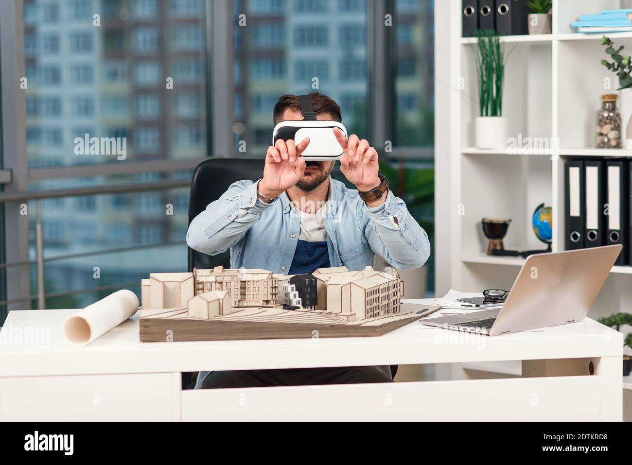 Skillful man as an architect reviewing architectural project with vr ...