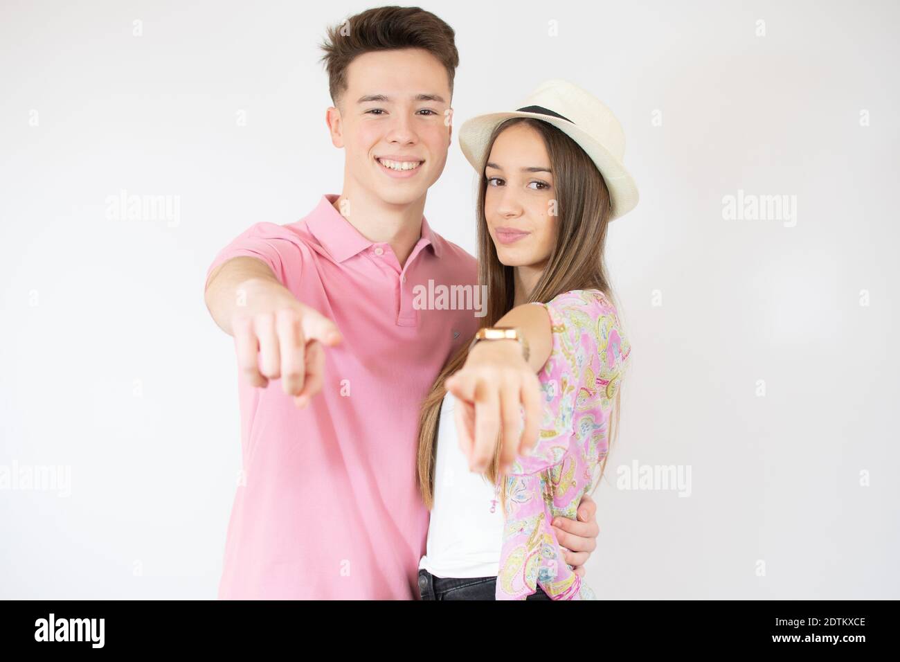 Happy couple love excited smiling point finger at you gesture ...