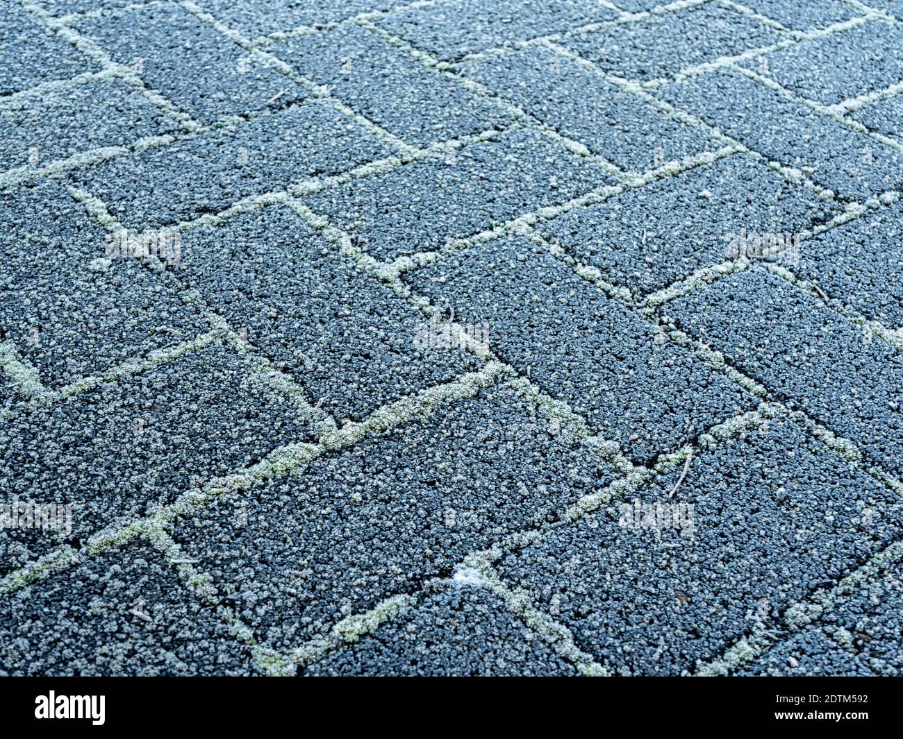 Ice on a sidewalk in winter Stock Photo - Alamy