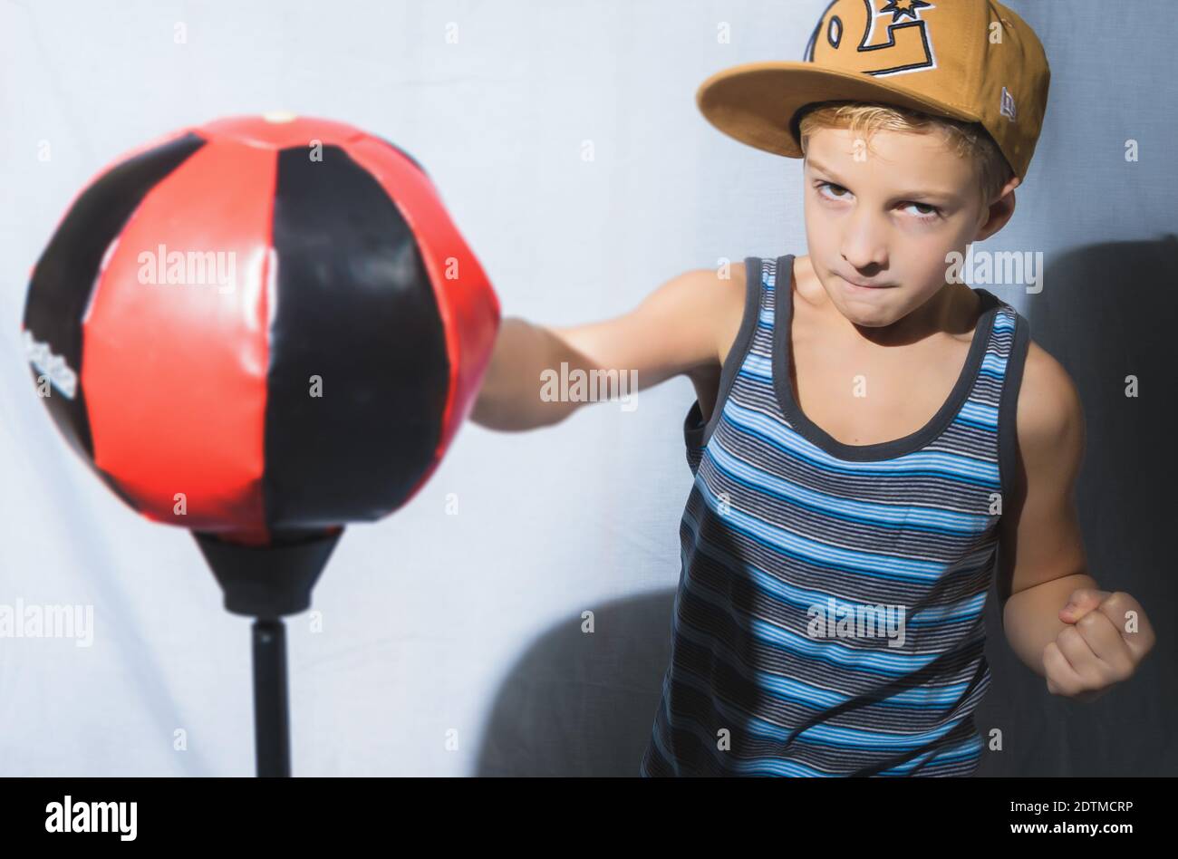 Boxing kid boy punching bag hi-res stock photography and images - Alamy