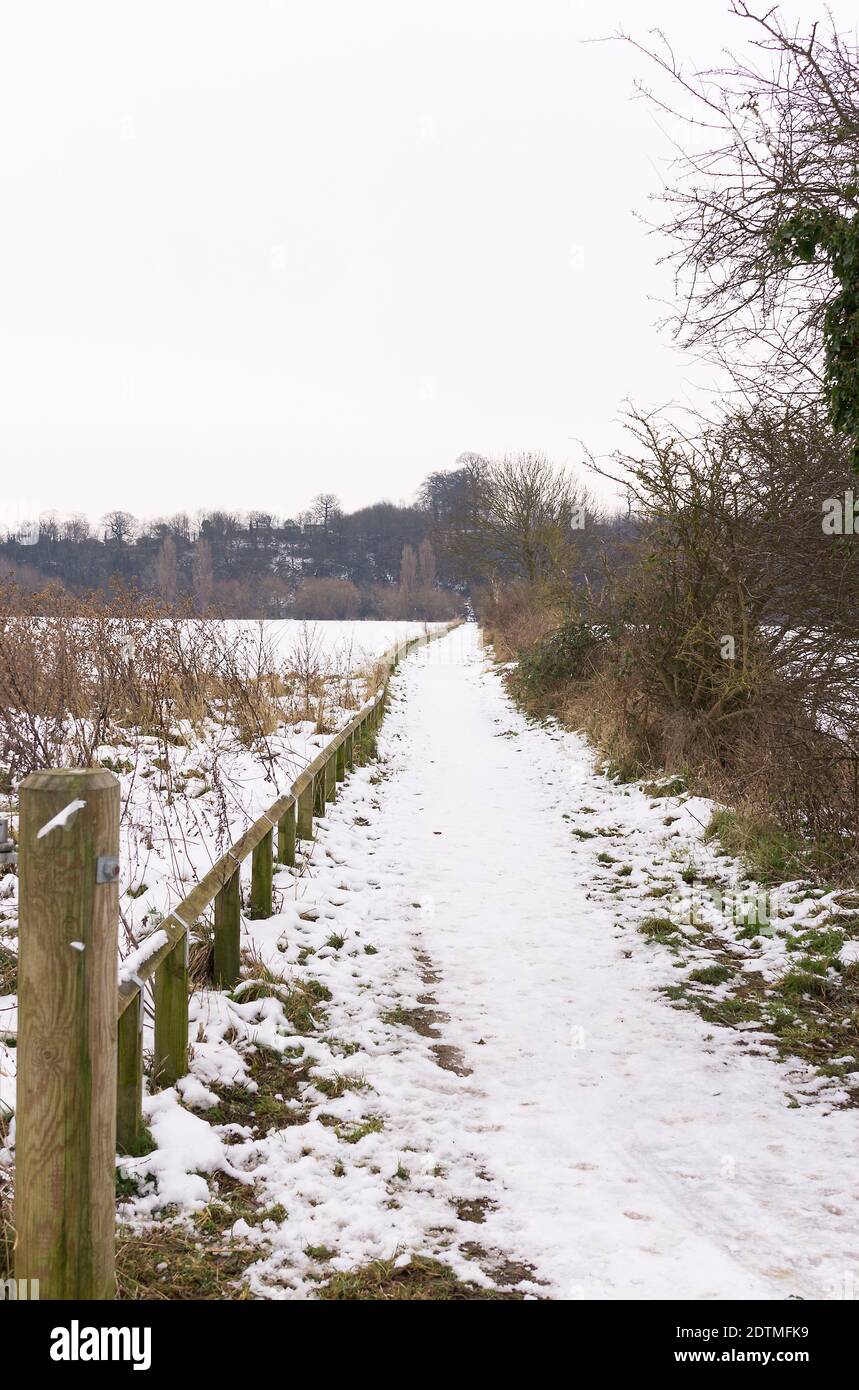 Long path covered in snow Stock Photo - Alamy