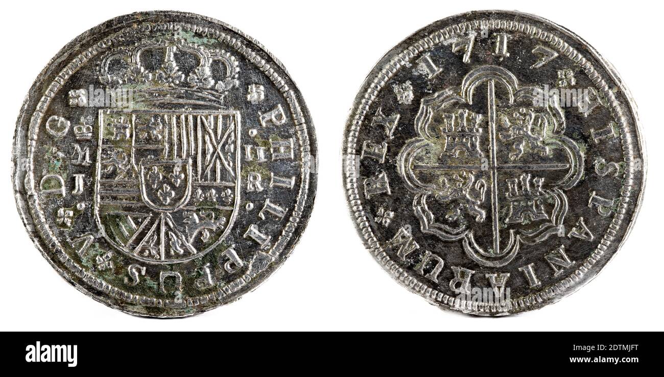 An ancient Spanish silver coin of King Felipe V isolated on a white ...