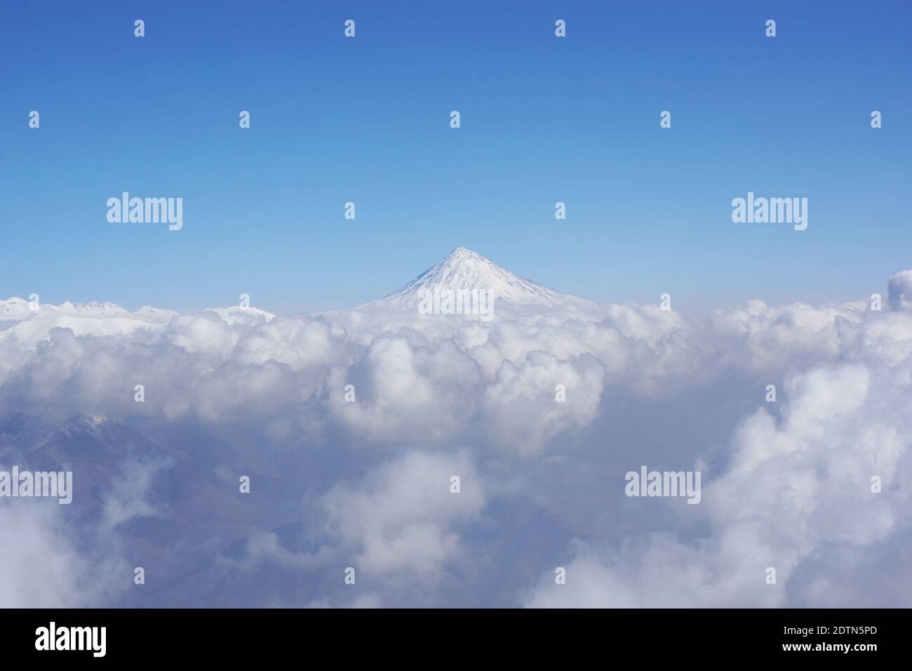 The magnificent Damavand peak surrounded by clouds captured in Iran ...