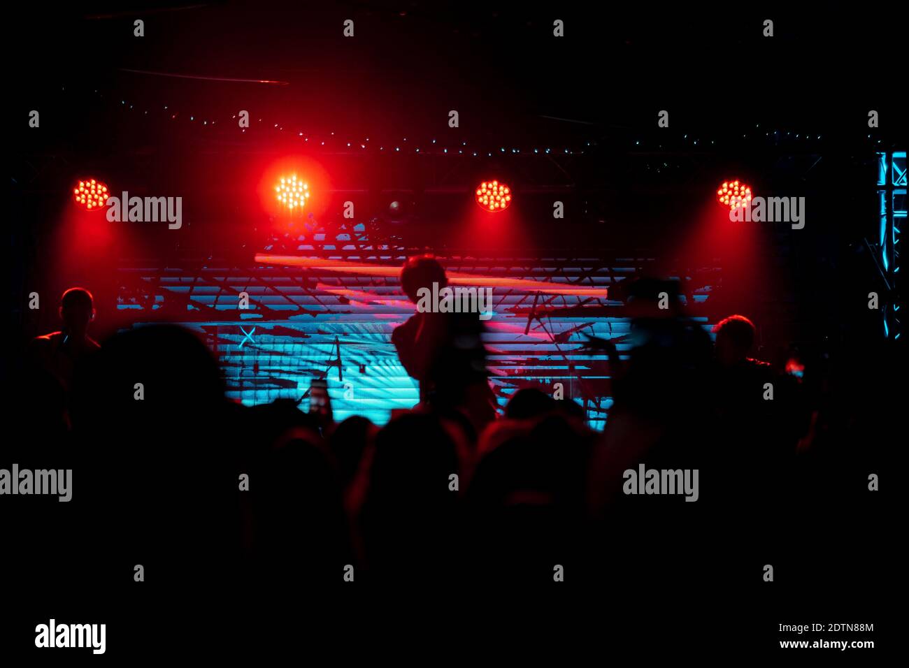 Photo of many people enjoying rock concert in nightclub Stock Photo - Alamy