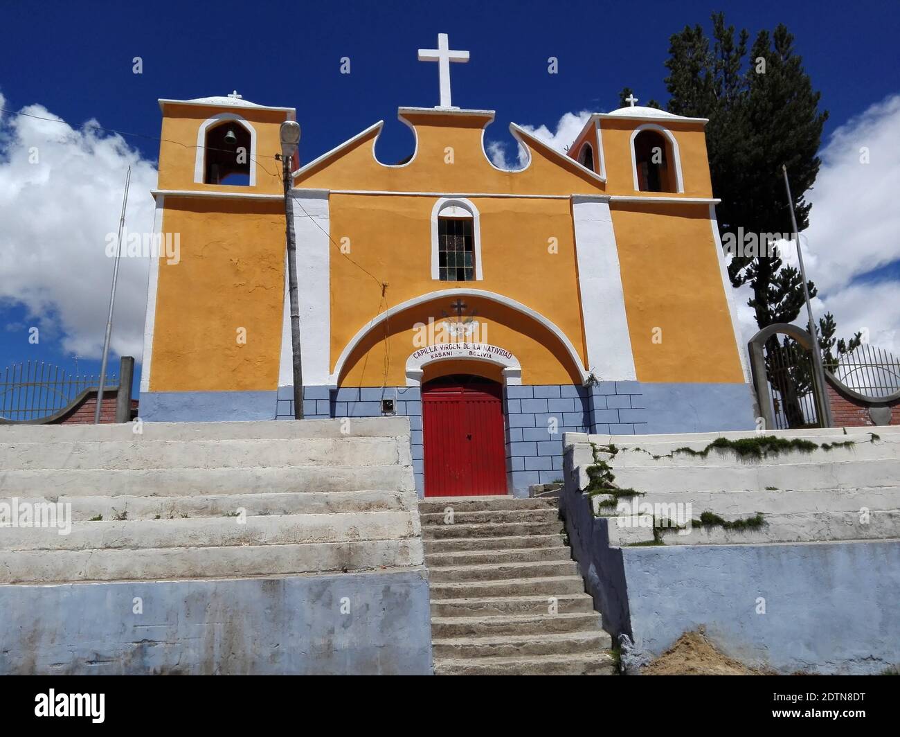 PUNO, PERU - Jan 11, 2017: yellow church with a light blue and white ...