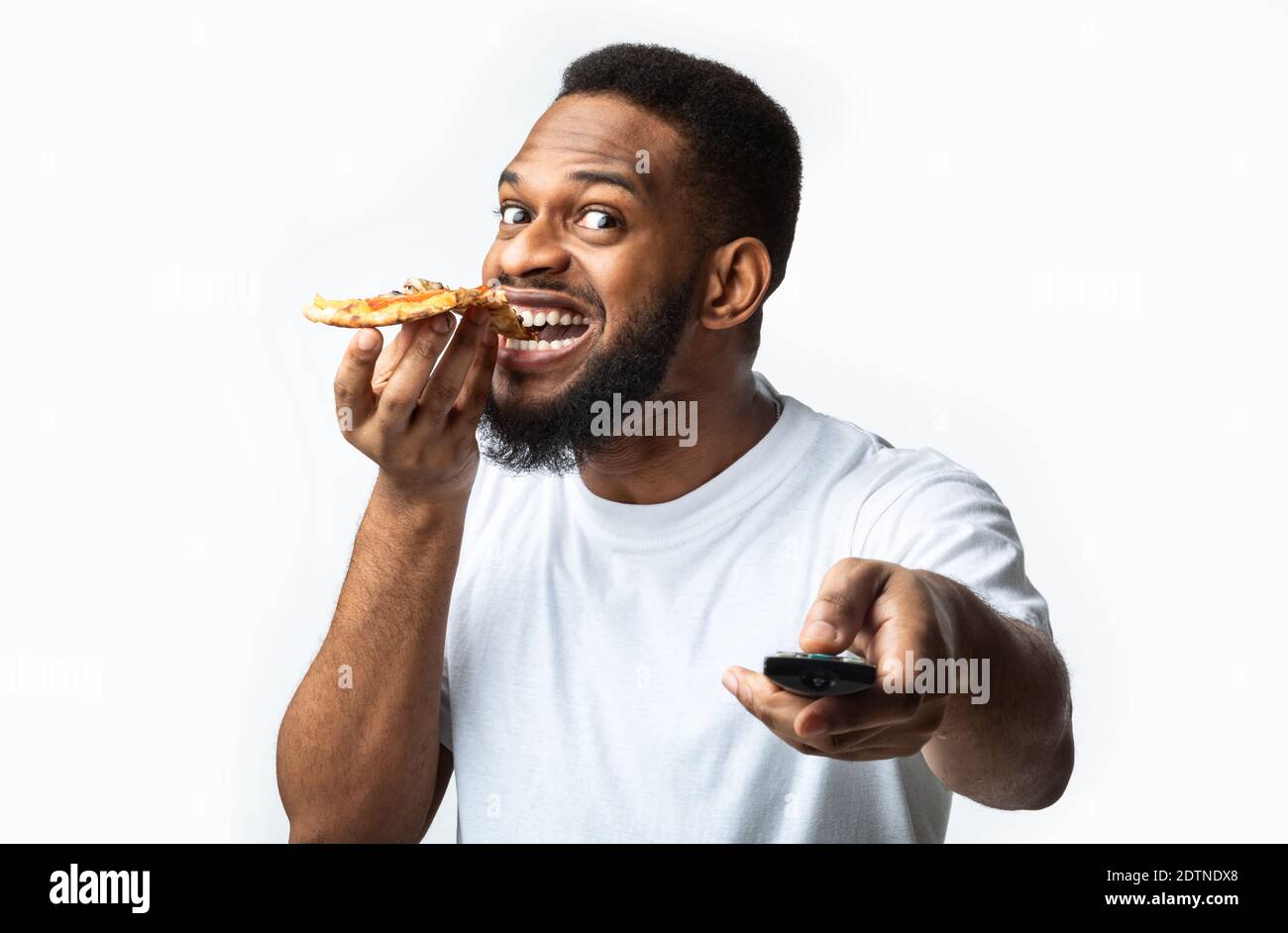 African Guy Eating Pizza And Watching Television On White Background ...