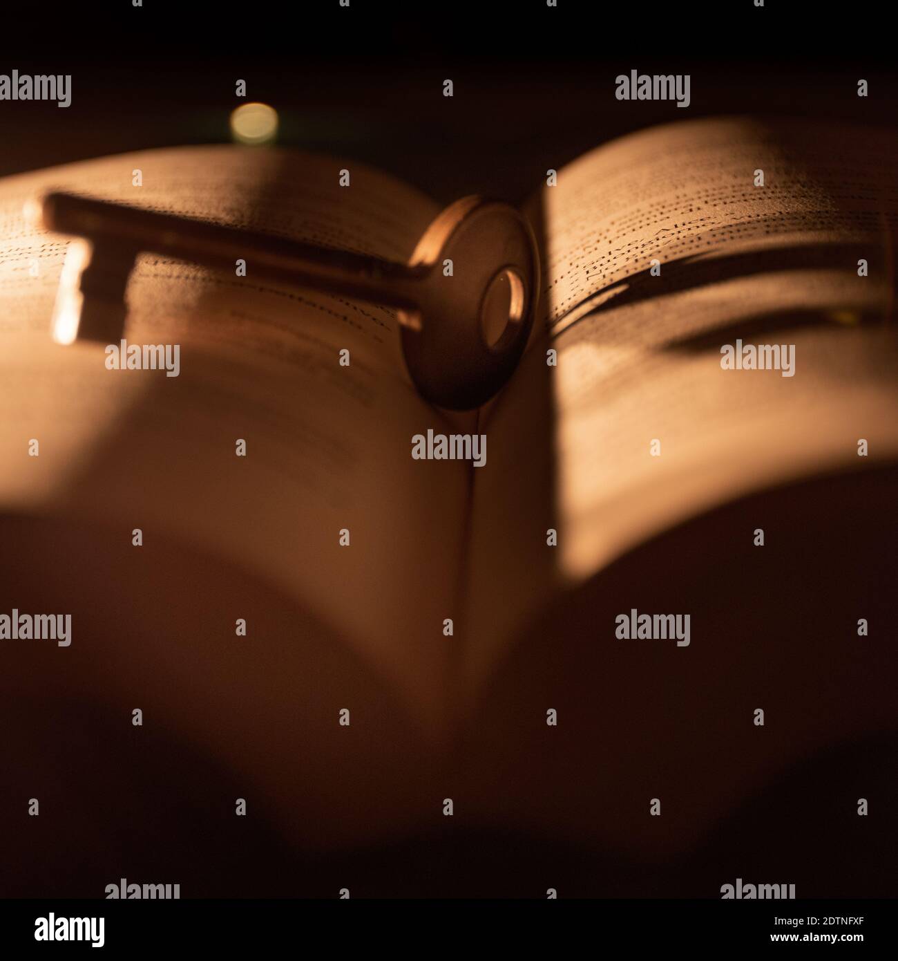 Close-up Of Open Book And Key Stock Photo - Alamy