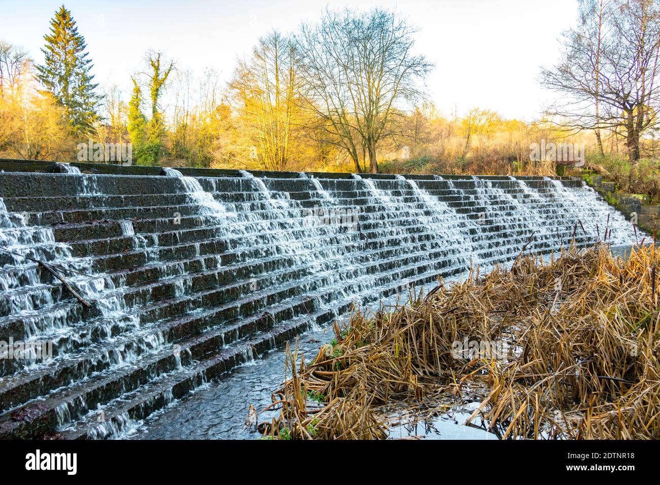 water tumbling down weir from lake in Trentham Gardens, Stoke on Trent ...