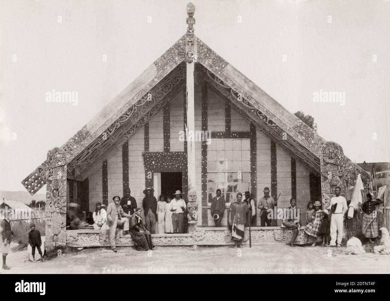 Vintage 19th century photograph - carved Maori house with Maori group ...