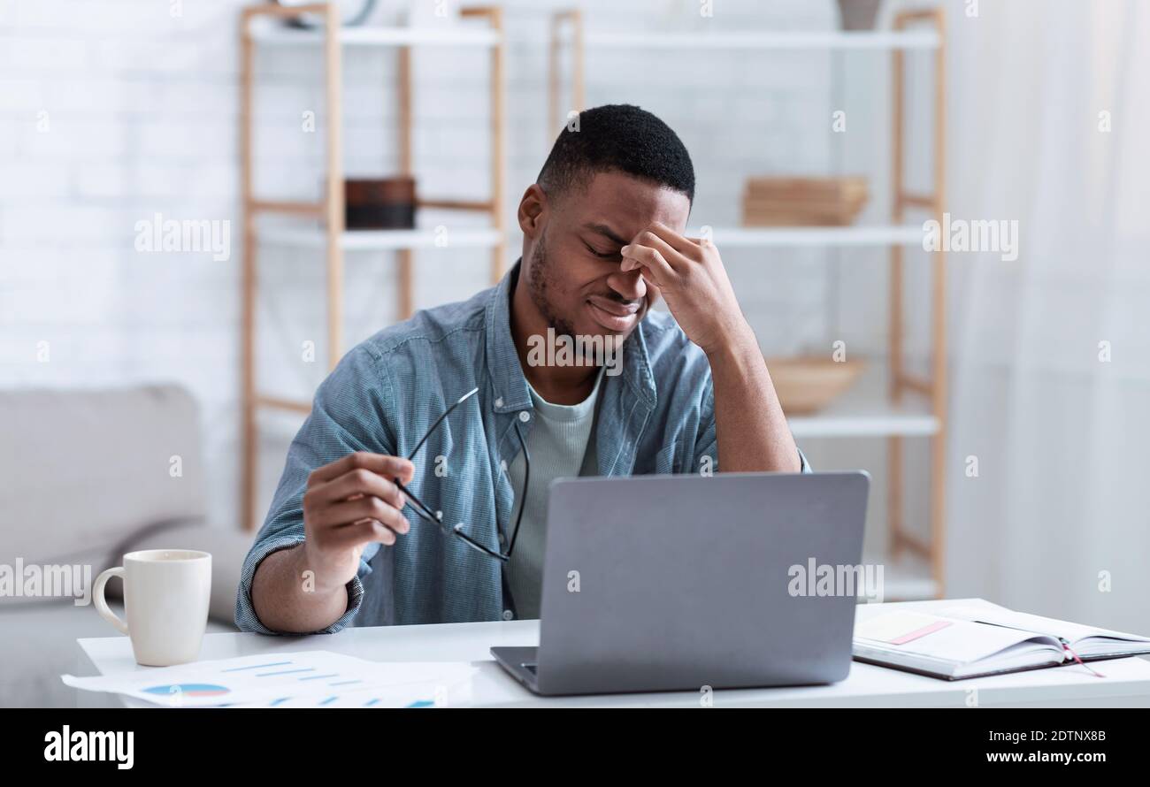 Man Having Eyes Fatigue Tired After Work On Computer Indoors Stock ...