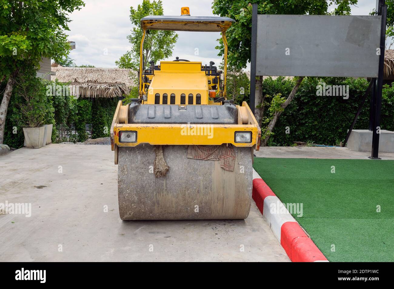 Front view of the steamroller a modern road roller with yellow color ...