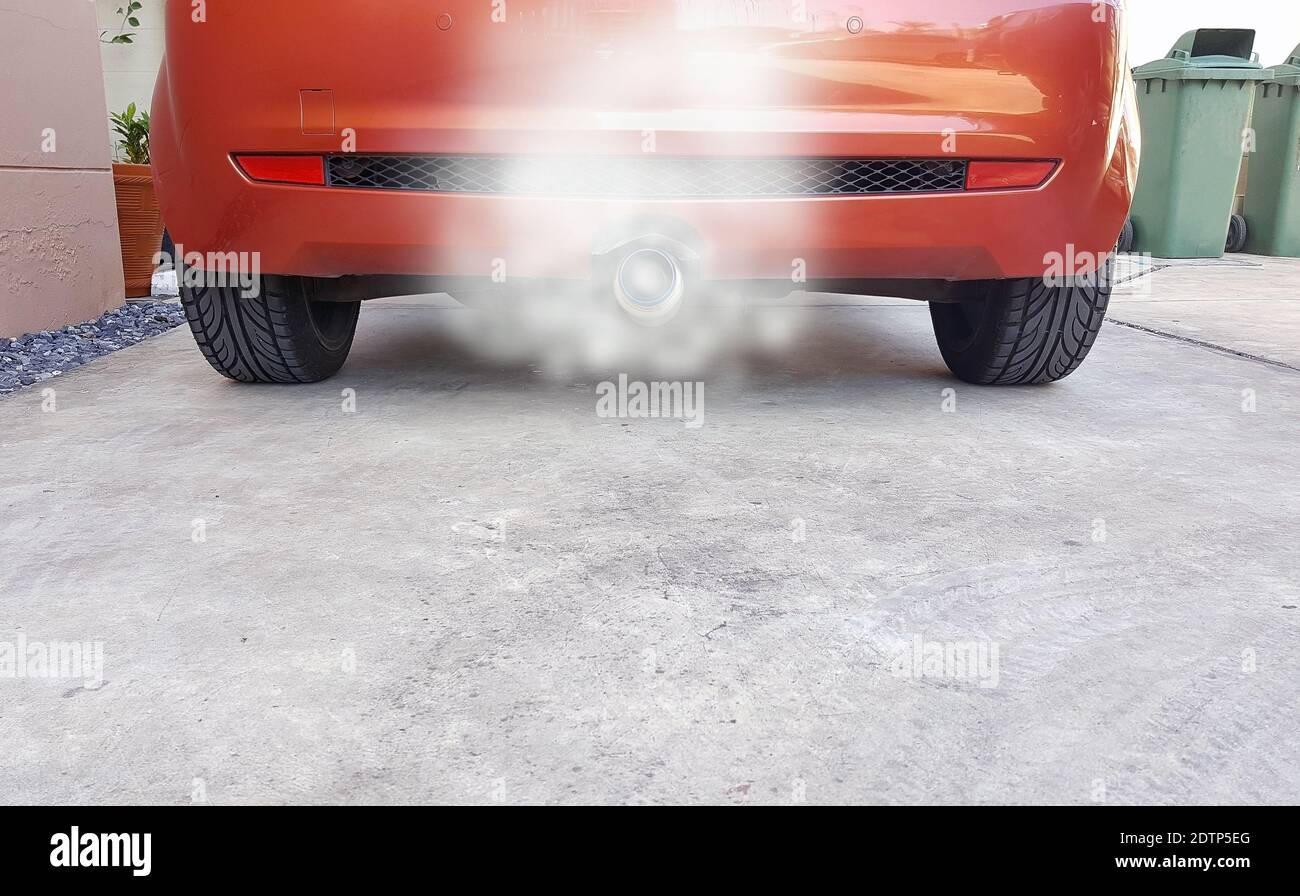 Closeup the smoke coming out of the exhaust system in stainless steel ...