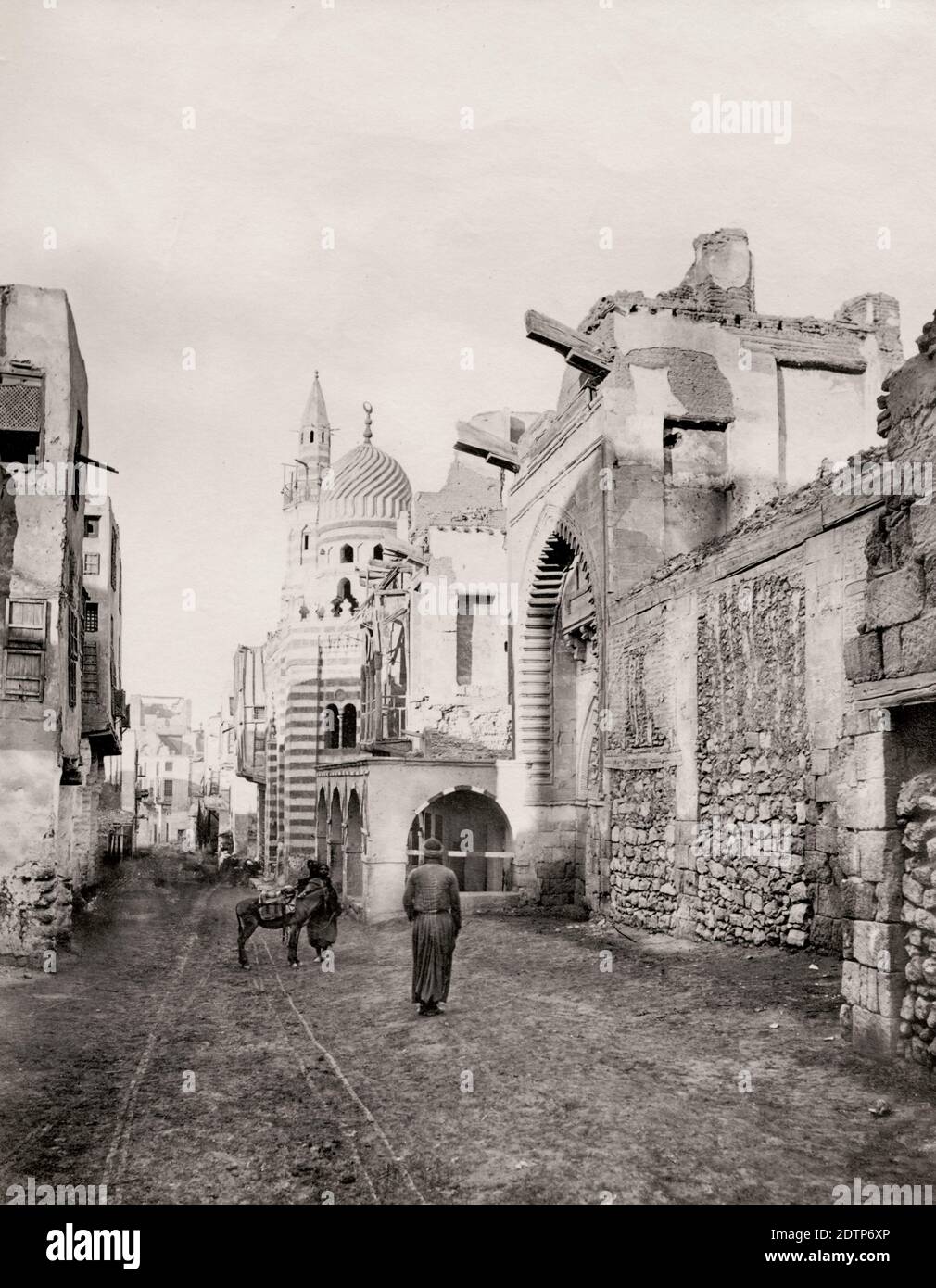 Vintage 19th century photograph - street scene in Old Cairo with mosque ...