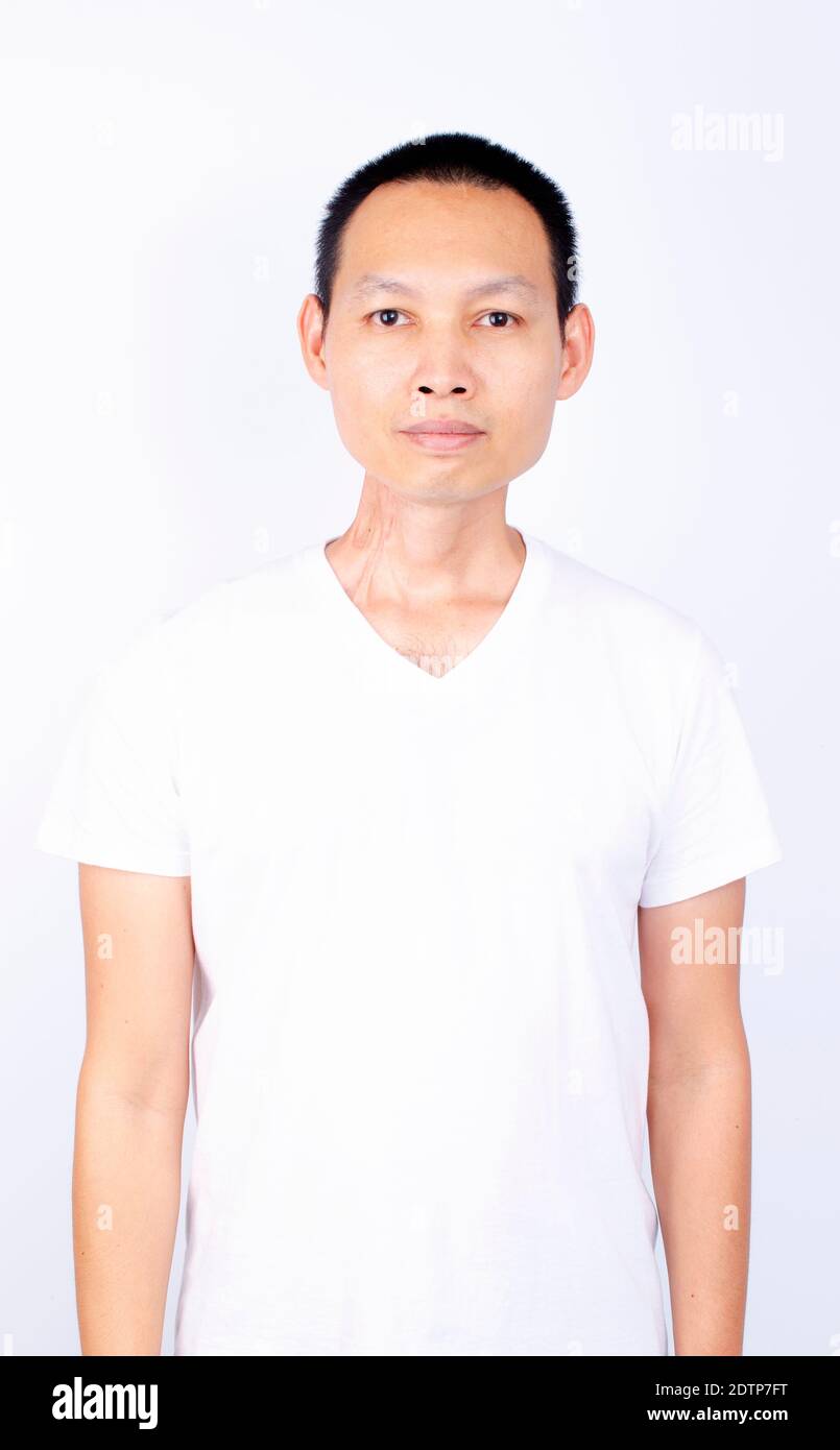 Portrait Of Man Standing Against White Background Stock Photo - Alamy