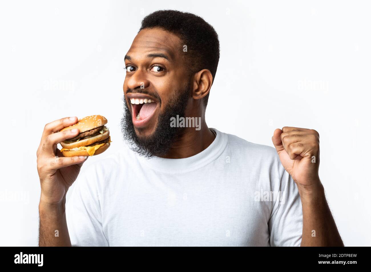 African american guy eating burger hi-res stock photography and images ...