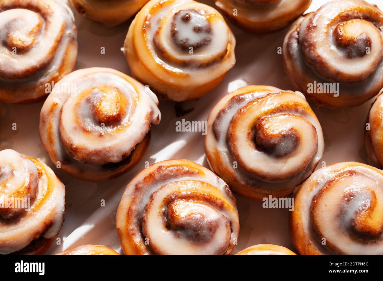 Top view of bite size cinnamon swirl rolls in a plastic tray ...