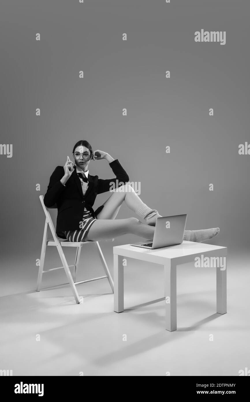 Cabinet. Young fashionable, stylish woman wearing jacket and socks ...