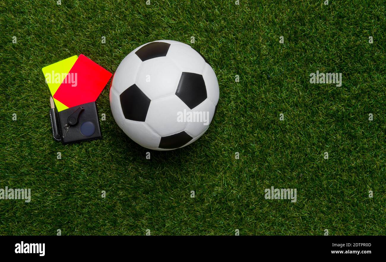 Football soccer referee equipment on green grass background. Top view ...