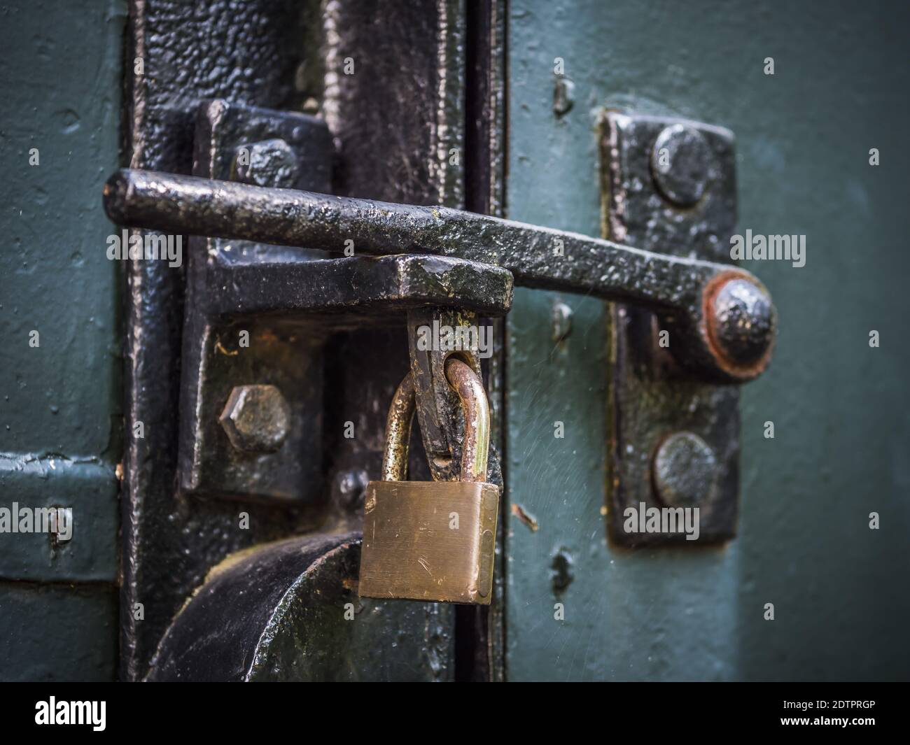 Old door handle with lock Stock Photo - Alamy