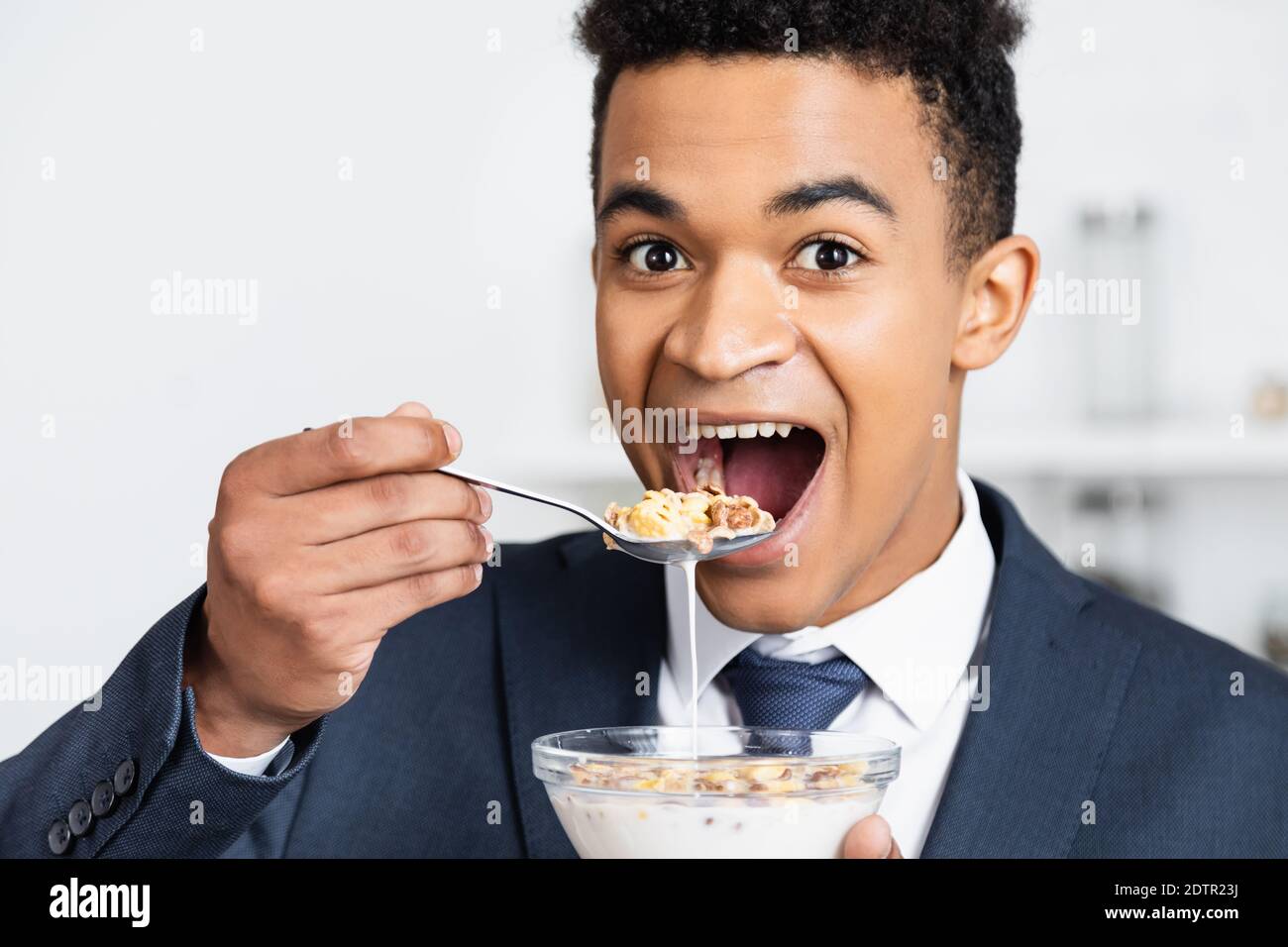 Handsome young man eating cereal hi-res stock photography and images ...