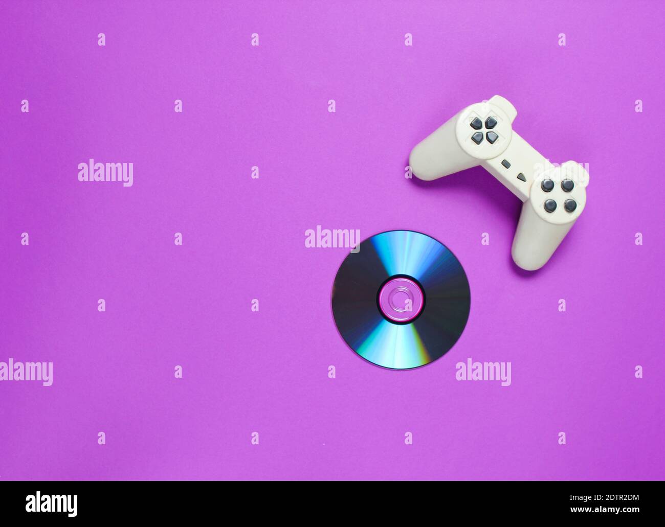 CD's disk, gamepad on a purple background. Retro gaming. Pop culture ...