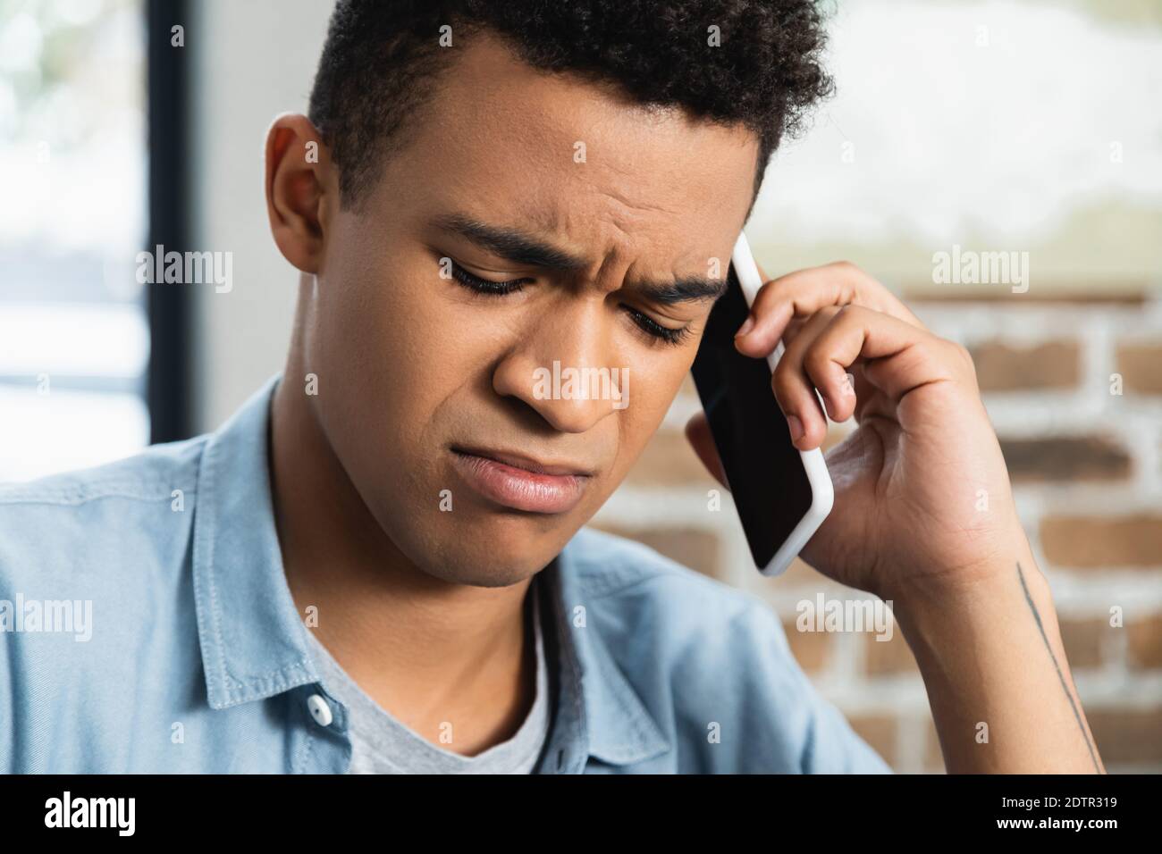 Sad african american man talking hi-res stock photography and images ...