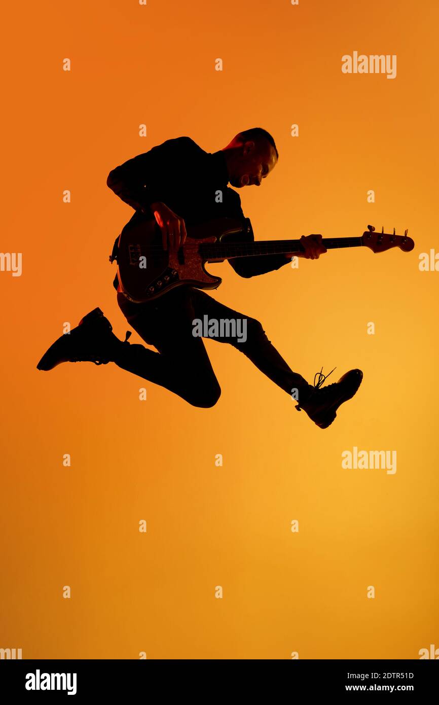 Guitarist Jumping Silhouette