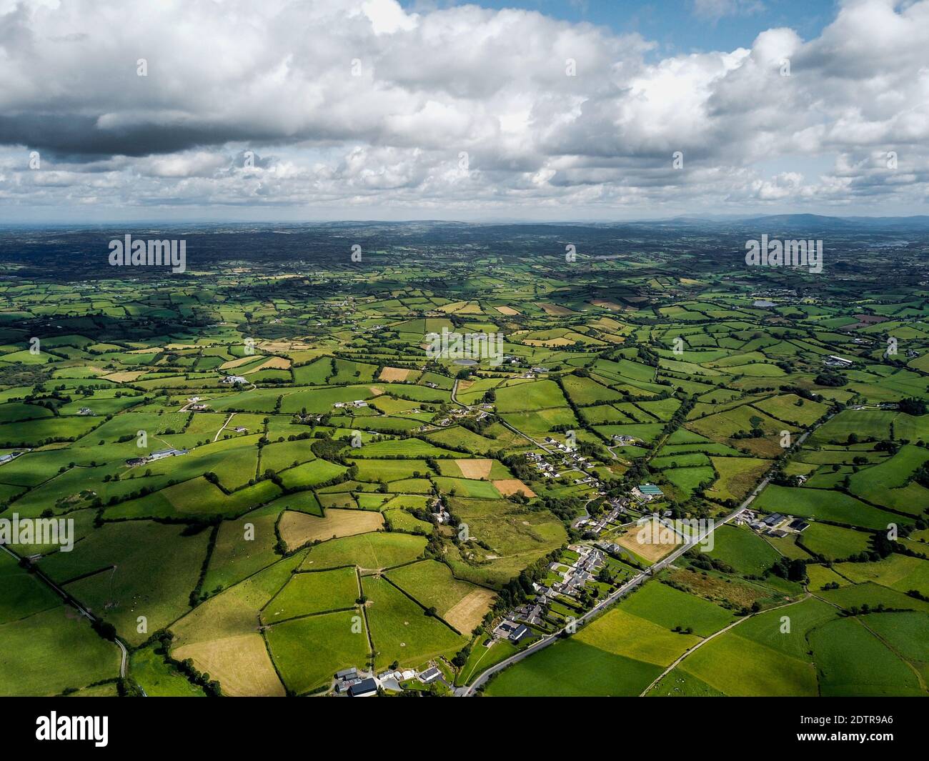 A beautiful landscape with rural houses and fresh greenery in Ireland ...