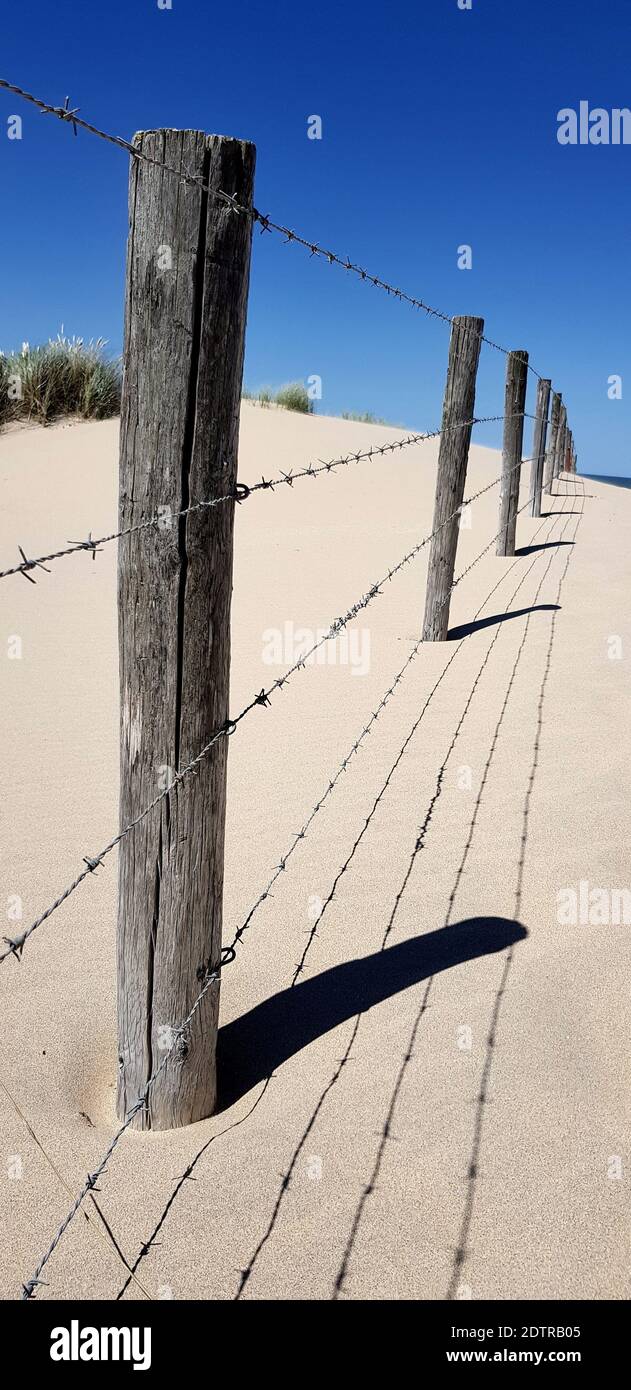 Barbed wire on the beach hi-res stock photography and images - Alamy